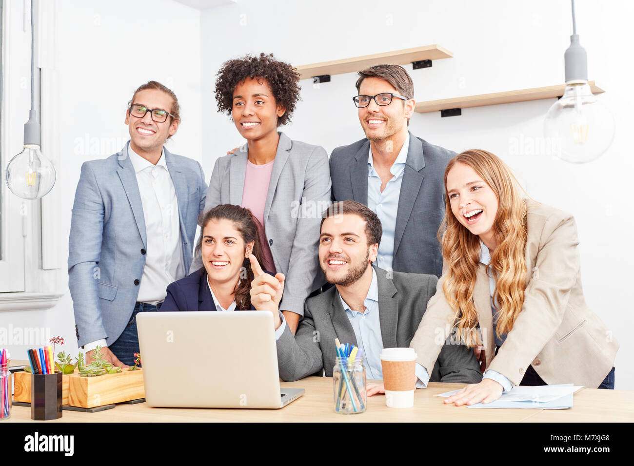 Creative business start-up team with laptop computer has a vision or ...