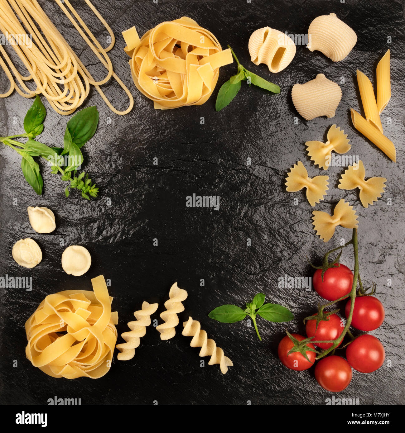 An overhead square photo of different types of pasta, including ...