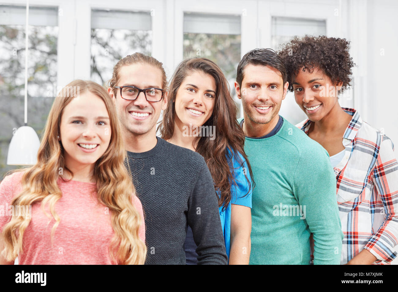 Positive smiling male female students hi-res stock photography and ...