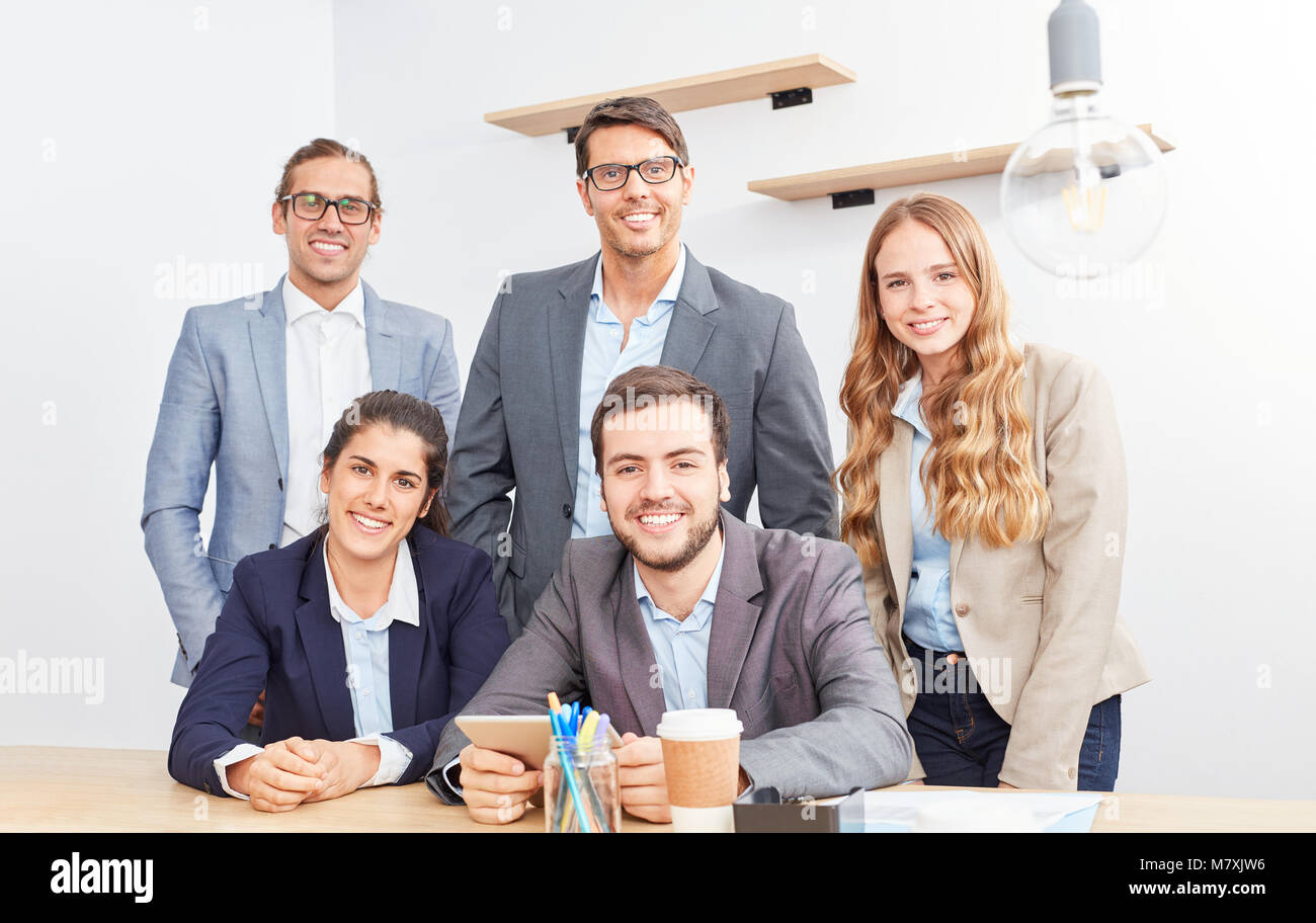 Group of young business people as start-up team form an office ...