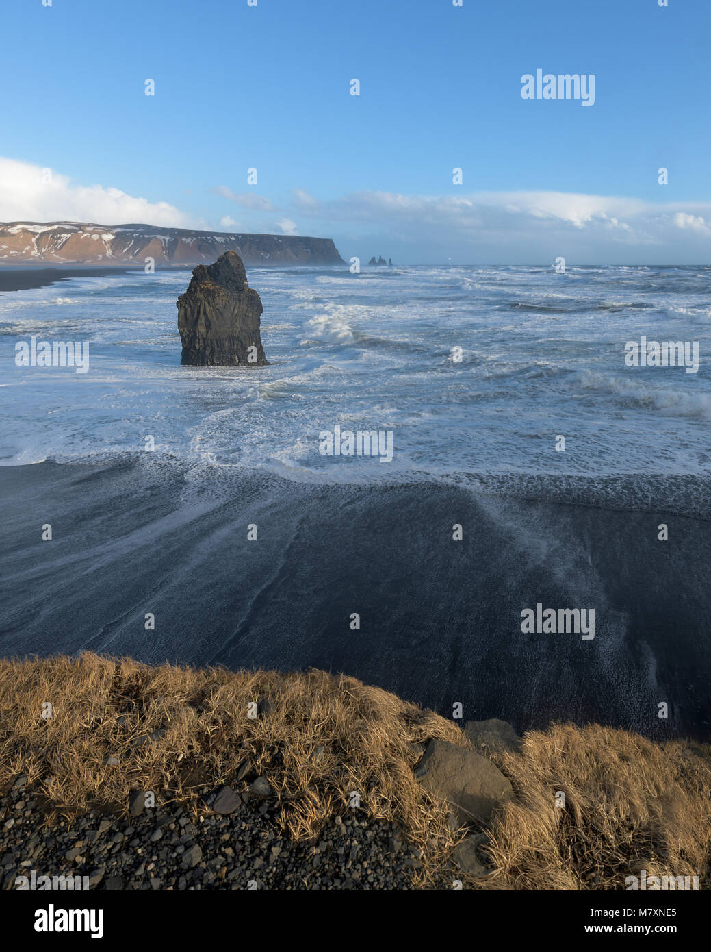 Reynisfjara black sand beach and Reynisdrangar basalt sea stacks as ...