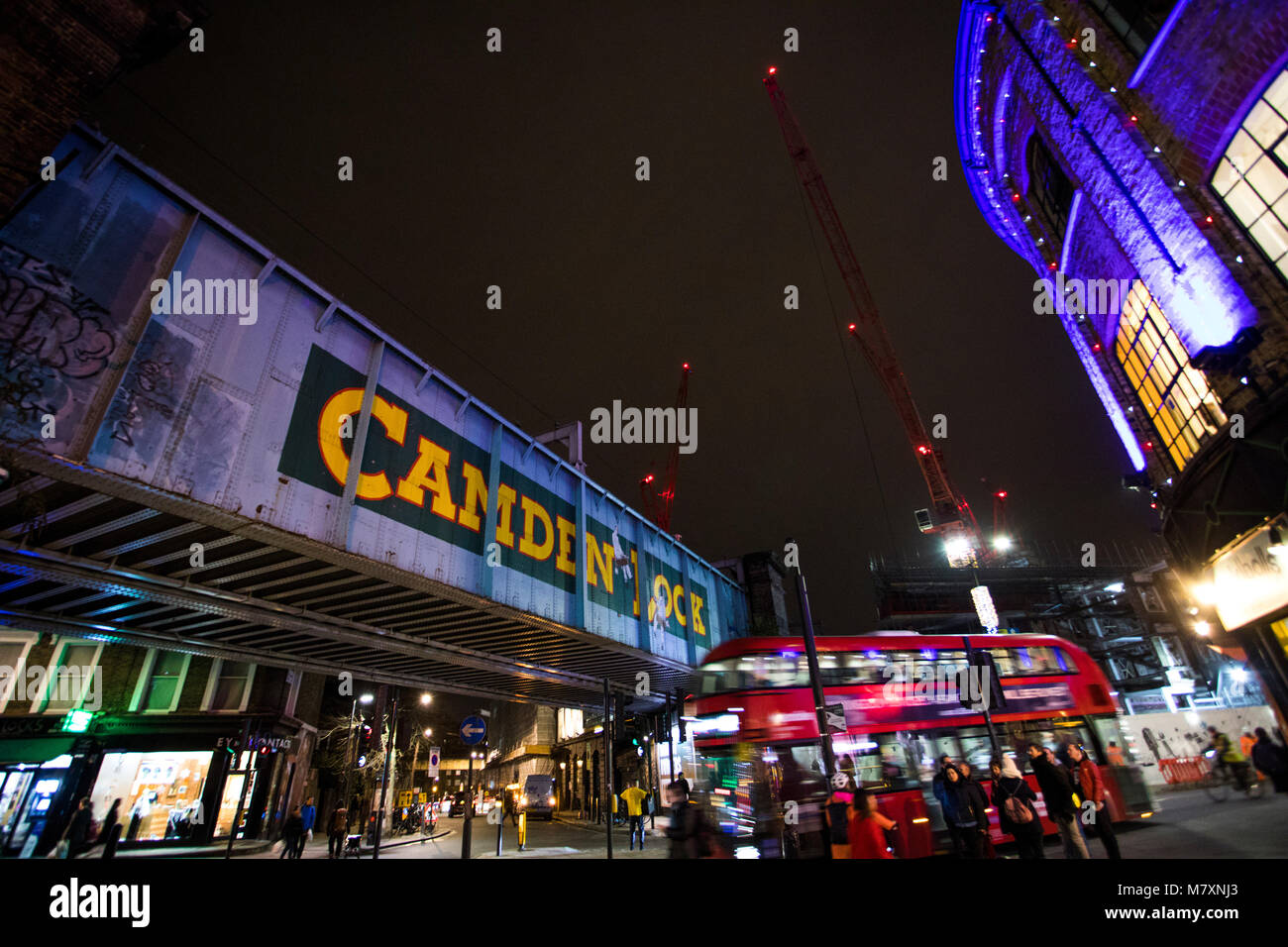 Blurred moving London red bus under Camden Lock bridge at night Stock ...