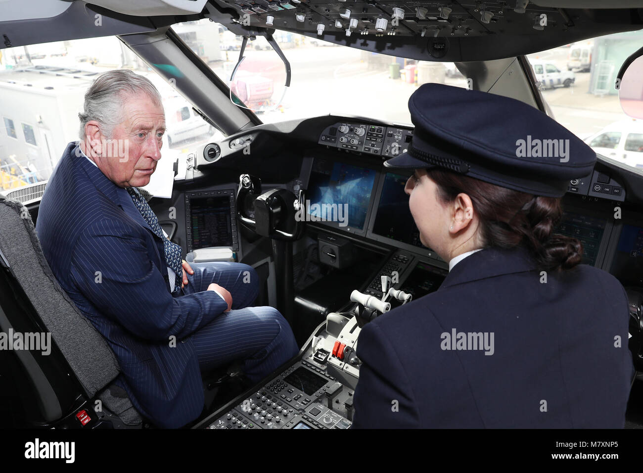 The Prince of Wales is shown the cockpit of a British Airways 787 ...