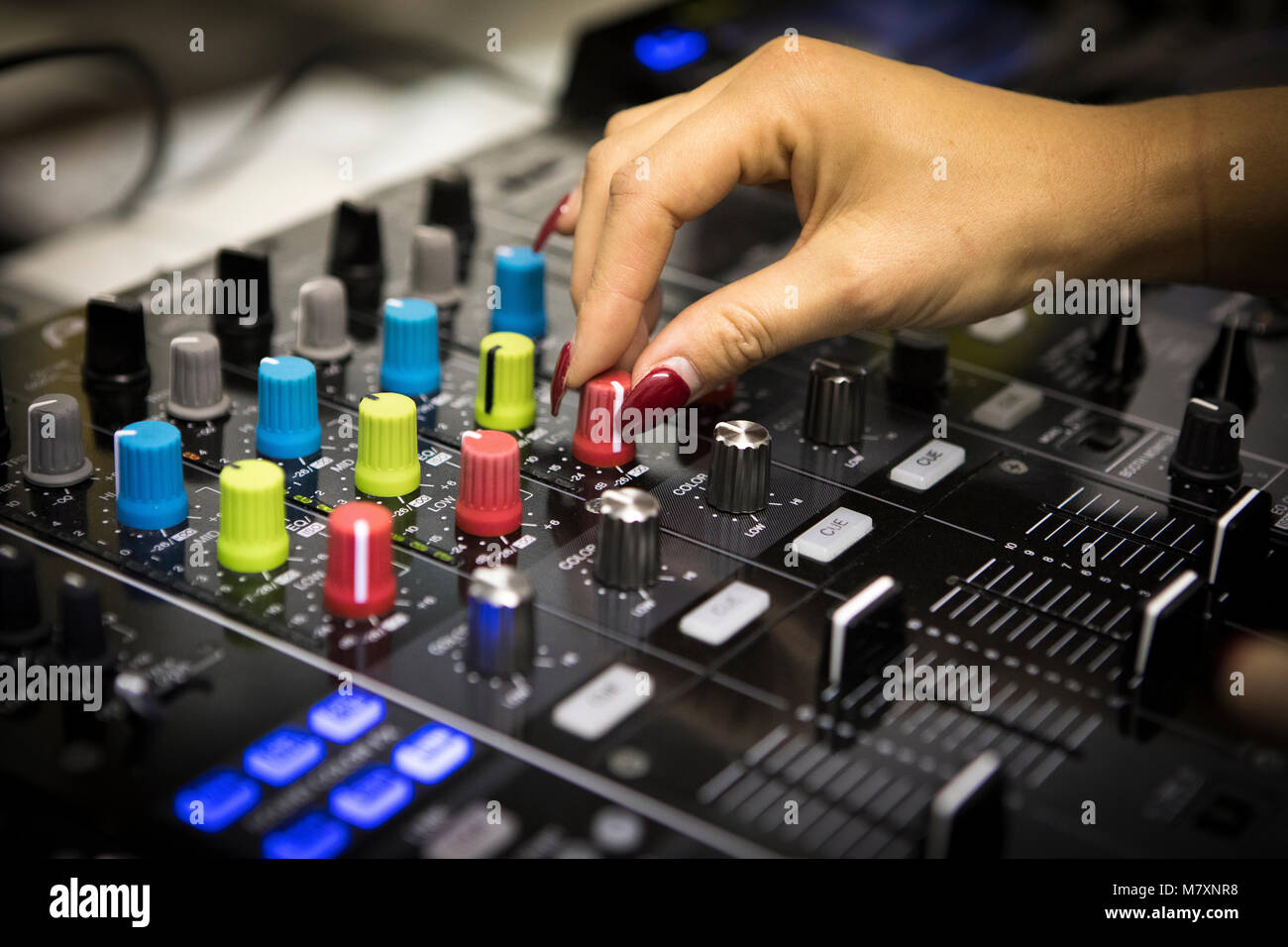 Female DJ with red fingernails on CDJ's and mixer Stock Photo - Alamy