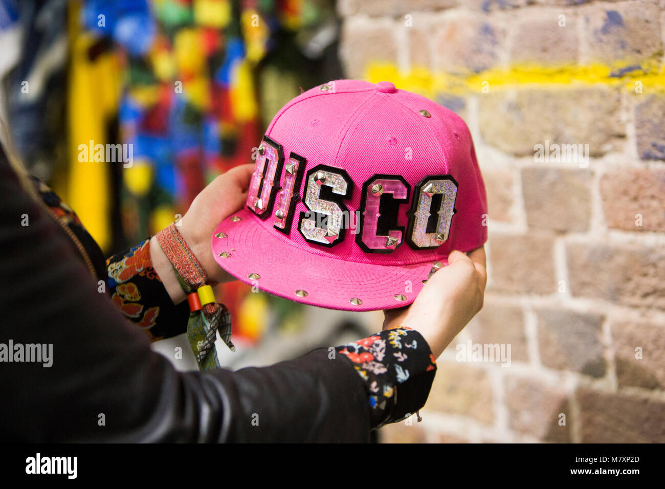 Pink disco baseball hat at vintage store Stock Photo - Alamy