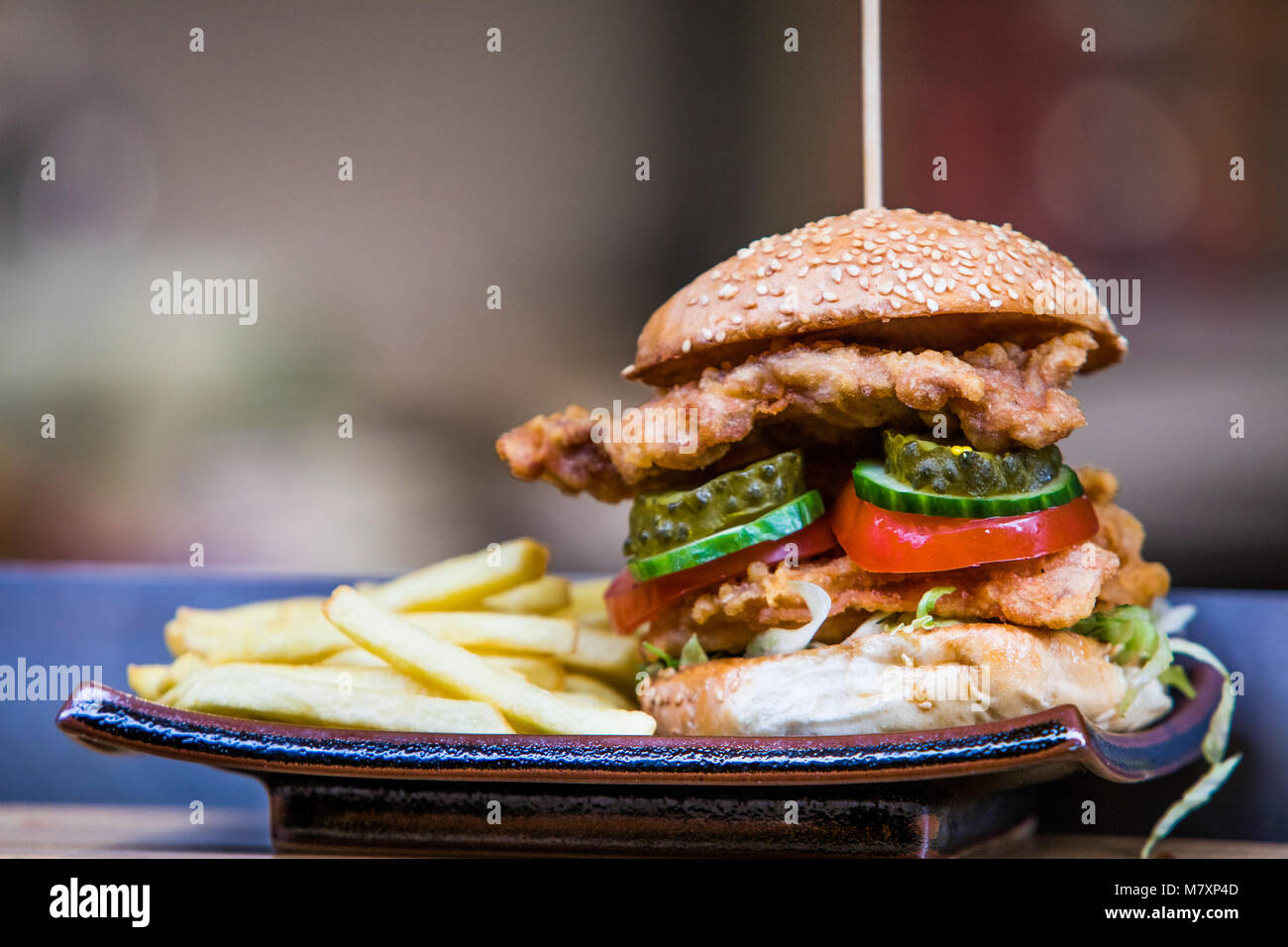 Crispy chicken burger at street food market Stock Photo - Alamy