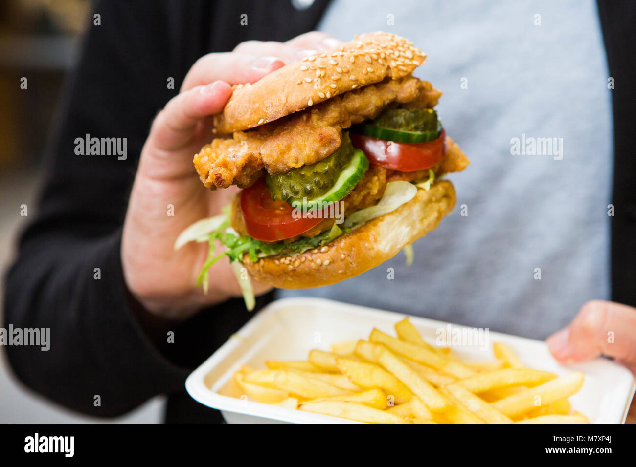 Crispy chicken burger at street food market Stock Photo - Alamy