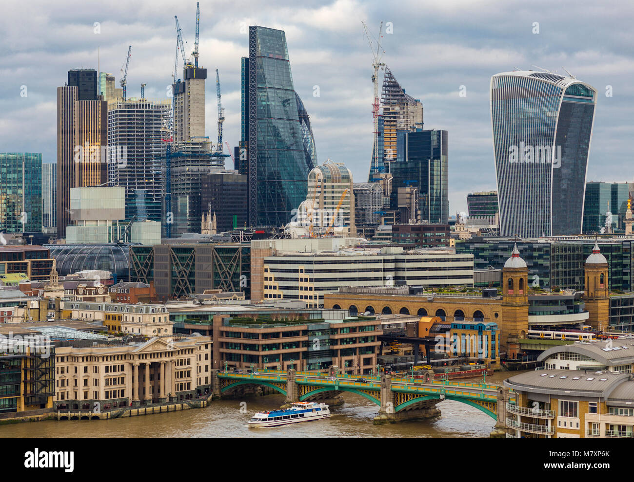 LONDON, UK – JAN 2018: Modern skyscrapers in City of London with Thames ...