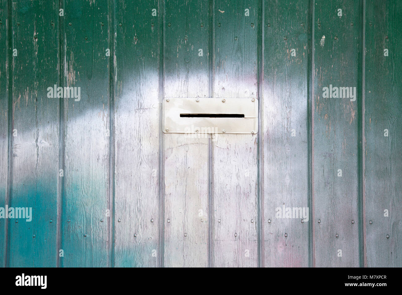 Letterbox on Green Door Background Stock Photo - Alamy