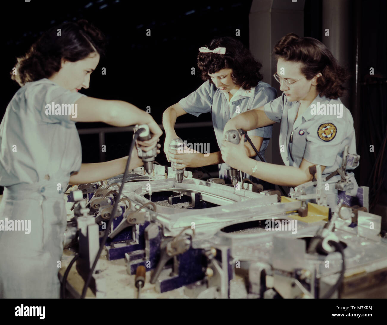 Three Female Workers Drilling Wing Bullhead for Transport Plane ...