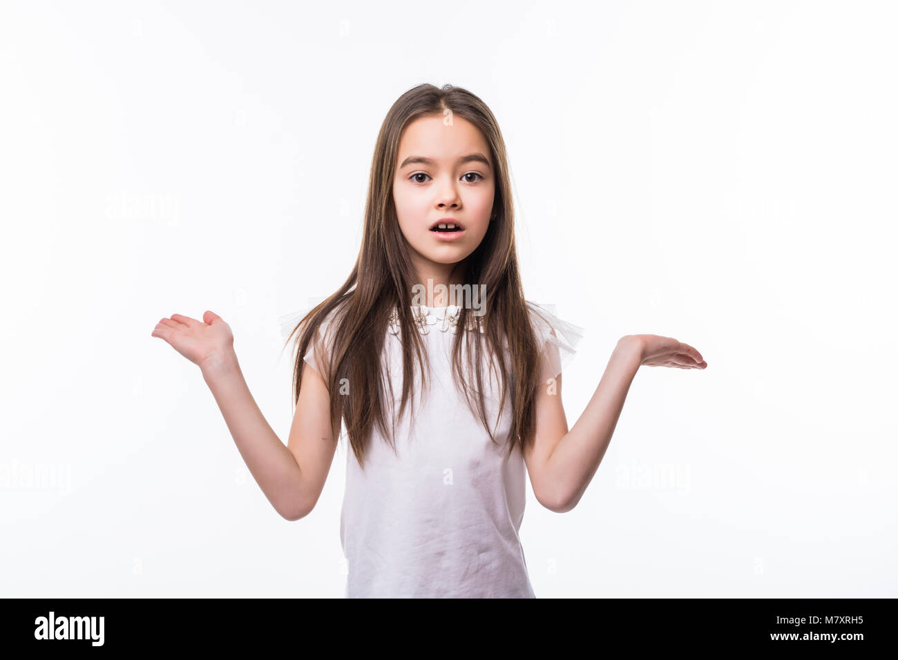 Beautiful little girl confused isolated over white Stock Photo - Alamy Beautiful little girl confused isolated over white Stock Photo - Alamy