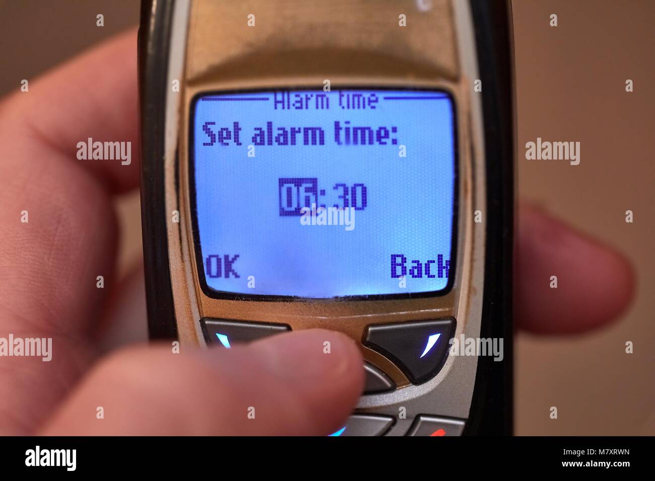 Setting alarm on phone hi-res stock photography and images - Alamy