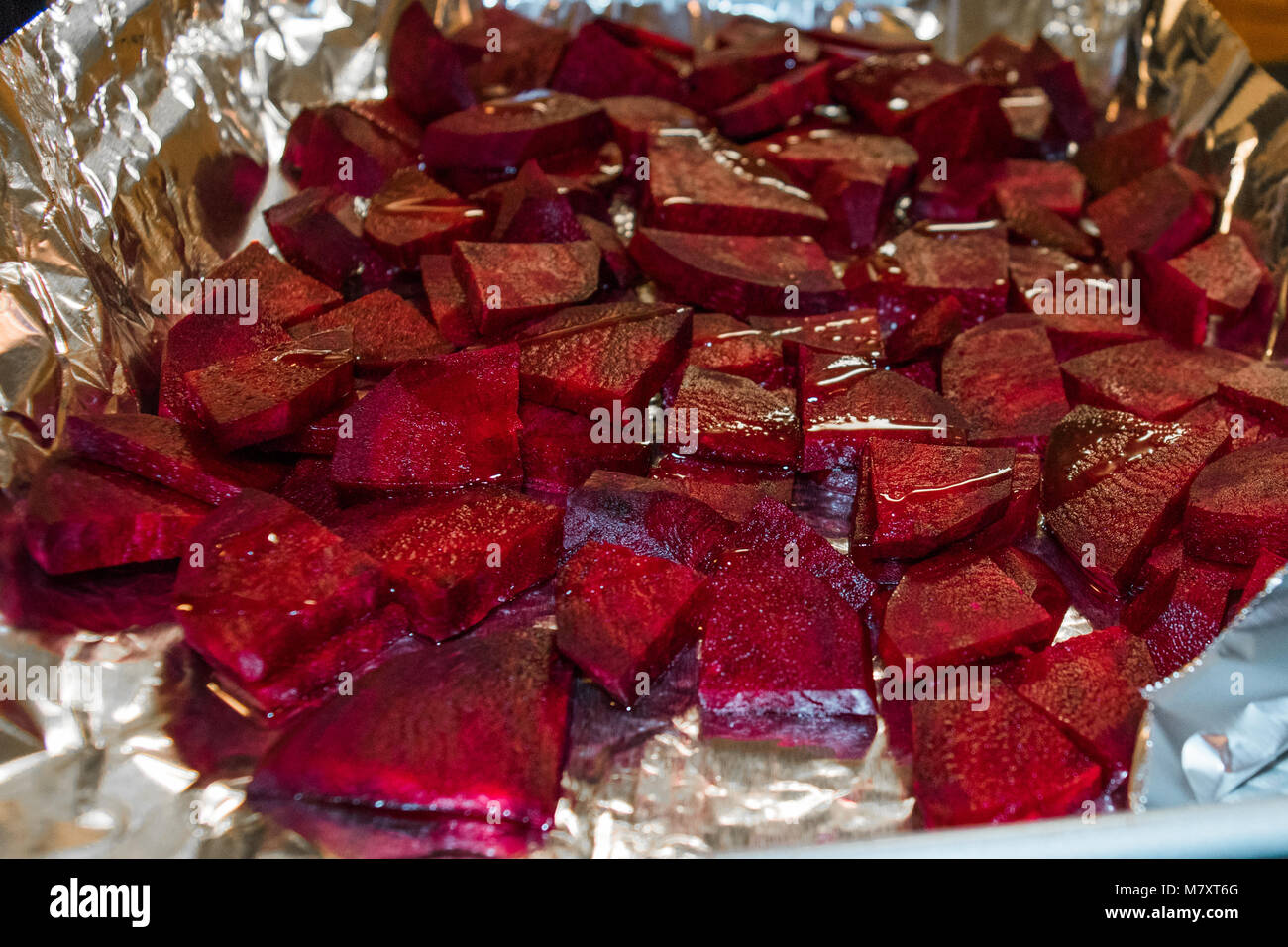 Sliced and oiled beets, ready to be roasted in the oven Stock Photo - Alamy