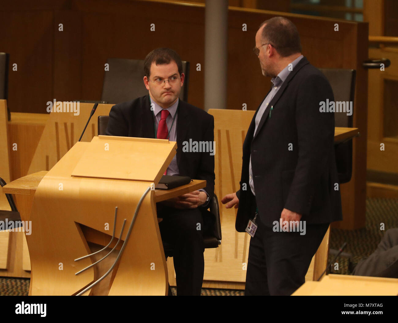 MSP Mark McDonald (left) acknowledges Scottish Green MSP Andy Wightman ...