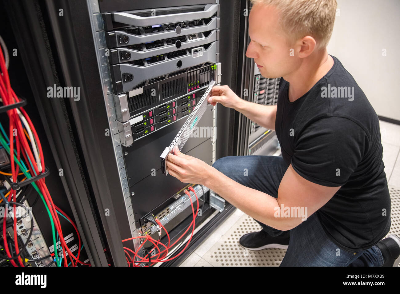 Engineer Checking Computer Server In Datacenter Stock Photo - Alamy