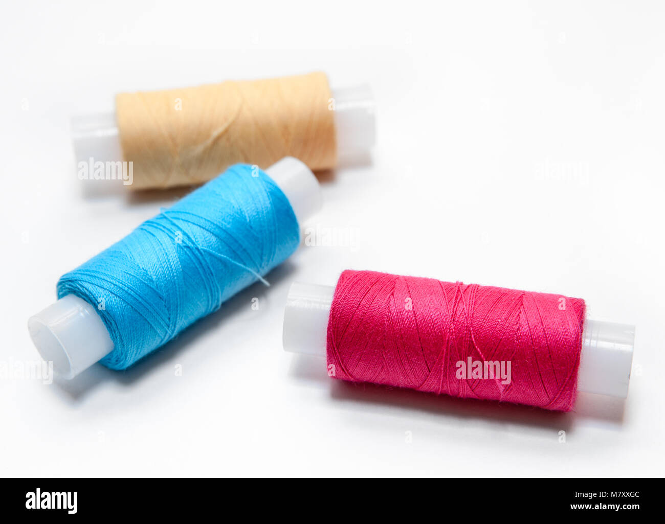 Stitching red thread on white Cut Out Stock Images & Pictures - Alamy