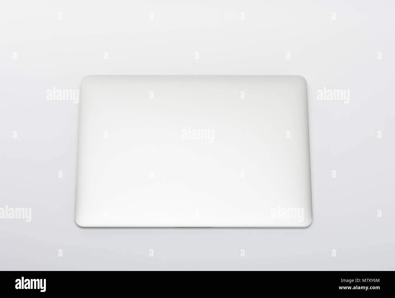 Closed modern, new laptop on white background, top view Stock Photo - Alamy