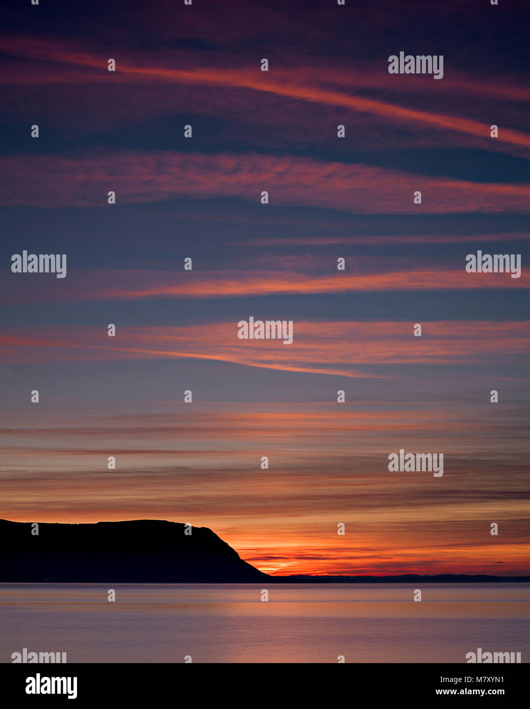Colourful clouds at dusk over the North Wales coast, Llandudno West ...