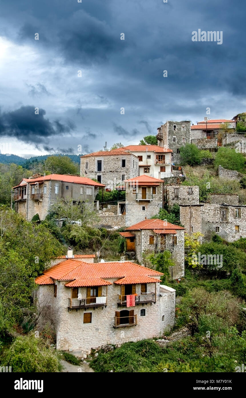 Traditional stone made houses in Stemnitsa village under a dramatic sky ...