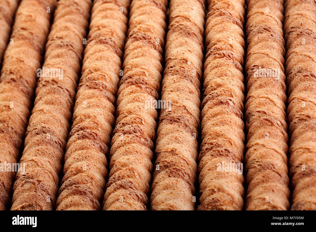 Waffle chocolate rolls stick closeup background Stock Photo - Alamy