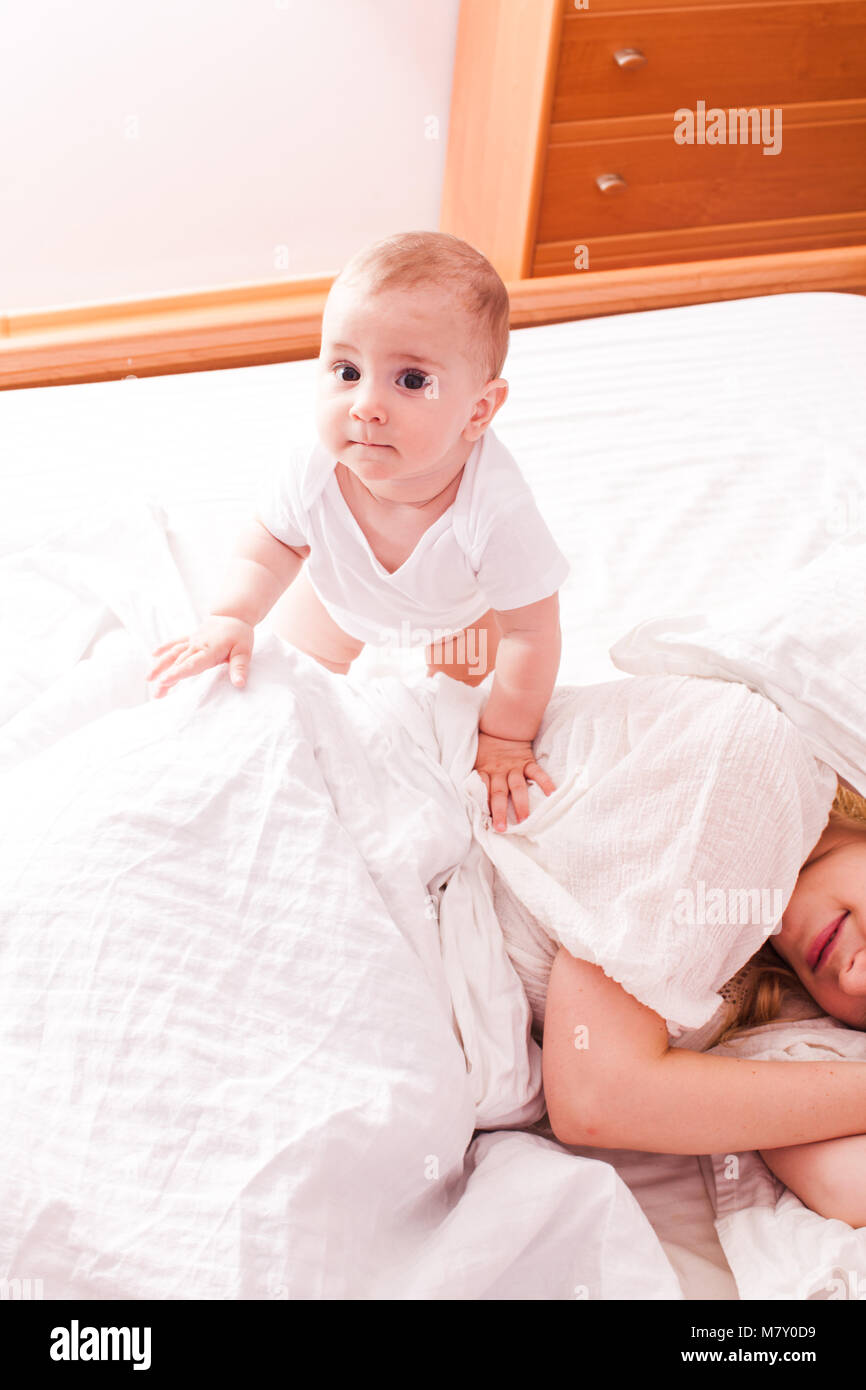 Baby Wake Up Sleepy Mom Stock Photo Alamy