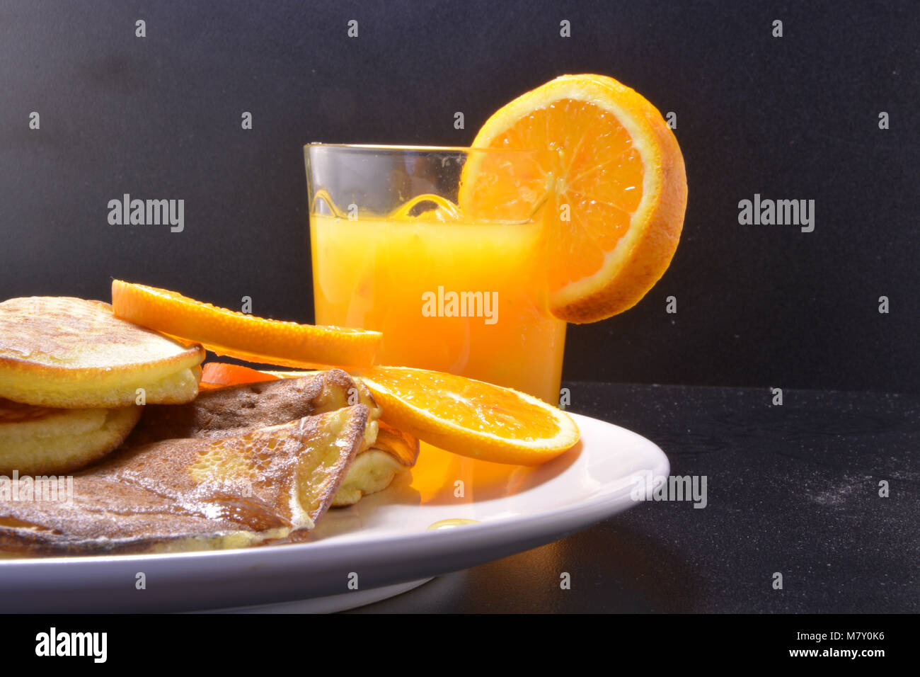 Sweet homemade pancake and fresh orange juice, breakfast Stock Photo ...