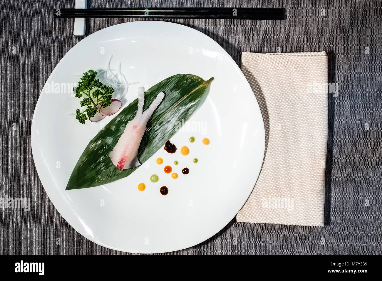 amberjack fillet on rice patty, yellowtail fish fillet nigiri on a ...