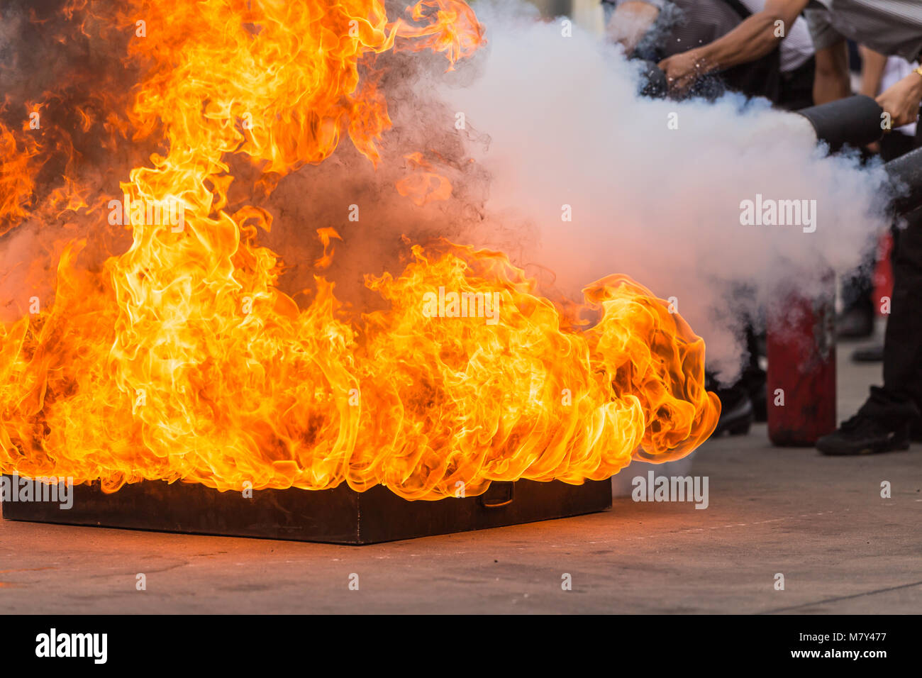 Firefighter using extinguisher water hi-res stock photography and ...