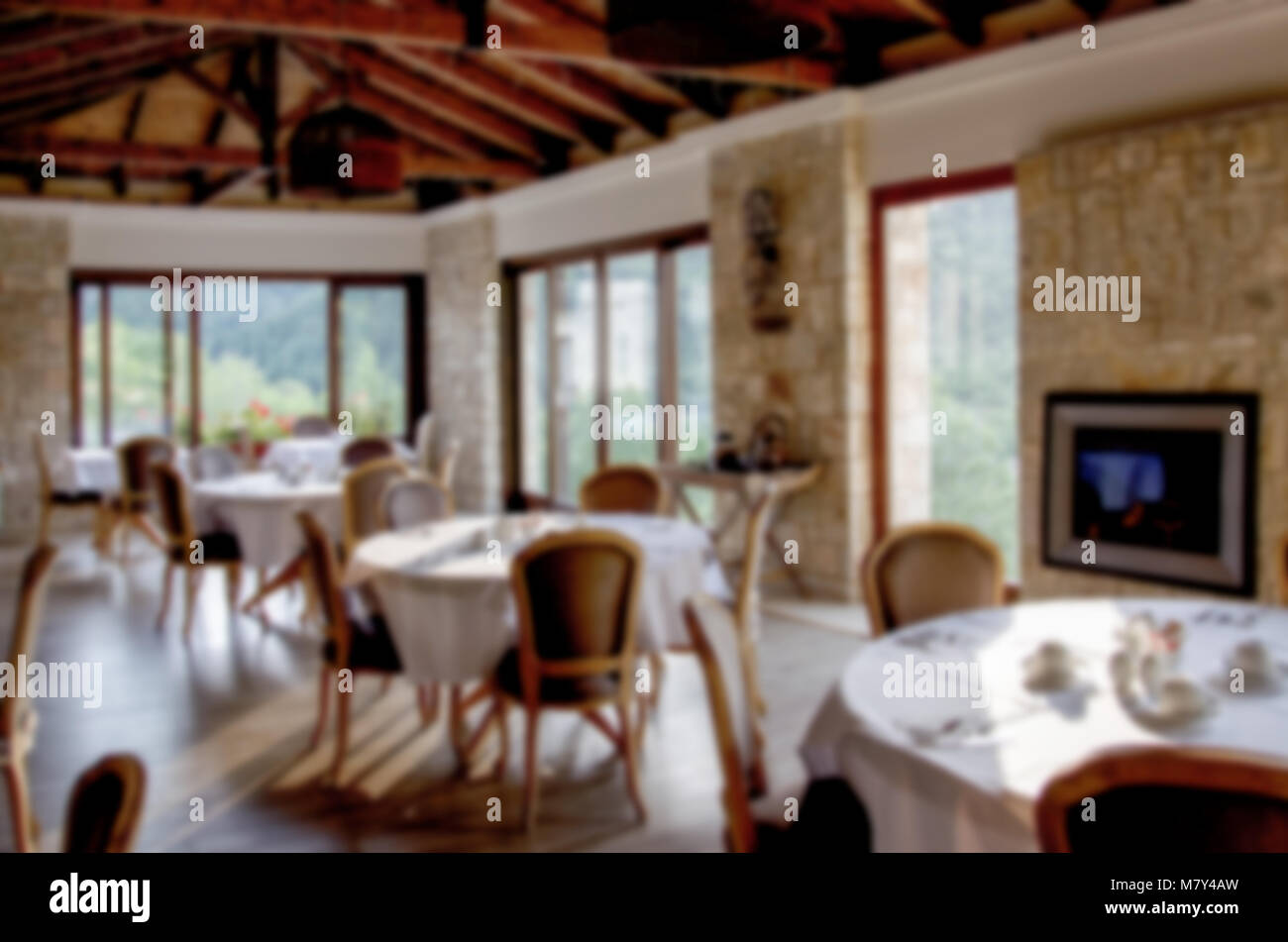 Interior of restaurant with wooden furniture and stone walls Stock ...