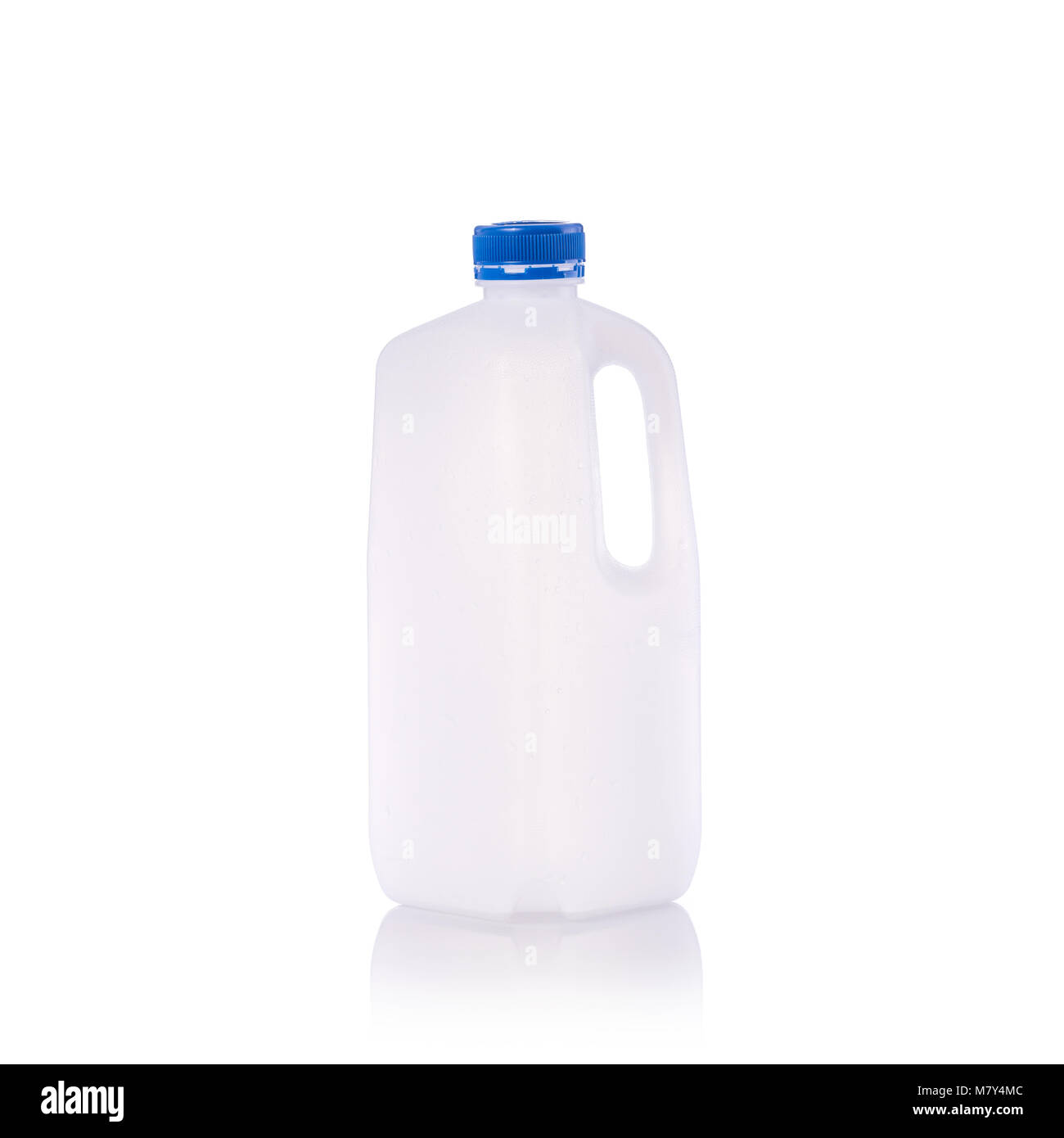 Clear blank empty milk bottle with blue cap. Studio shot isolated on ...