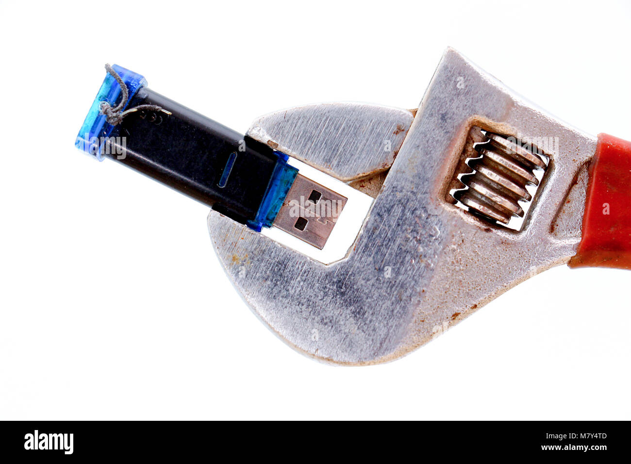 old usb drive pressed with adjustable wrench,image Stock Photo - Alamy
