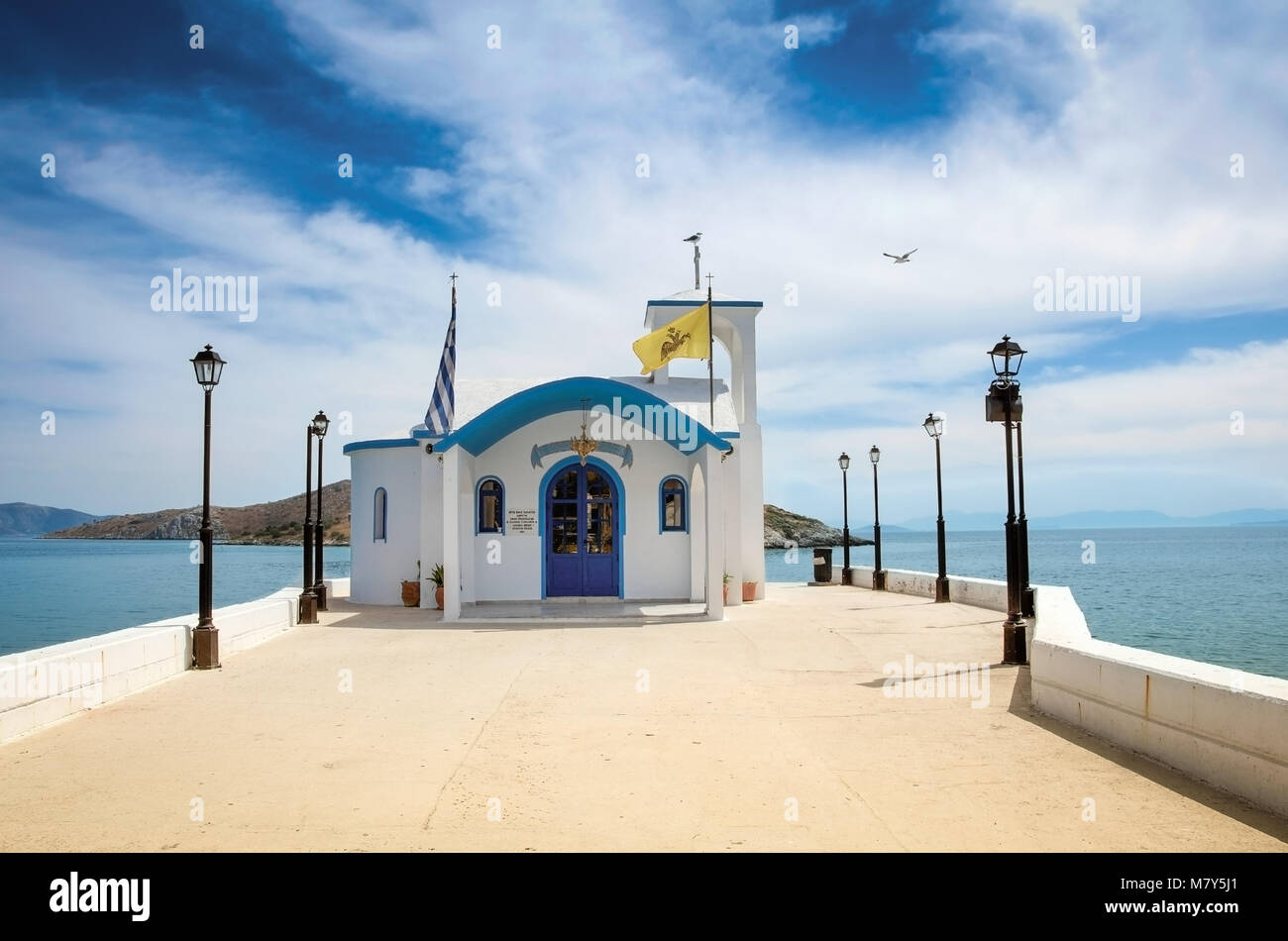 Perspective image of a Small greek orthodox chapel with some clouds ...