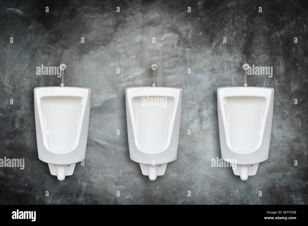 New row of ceramic outdoor urinals in men public toilet install on the ...