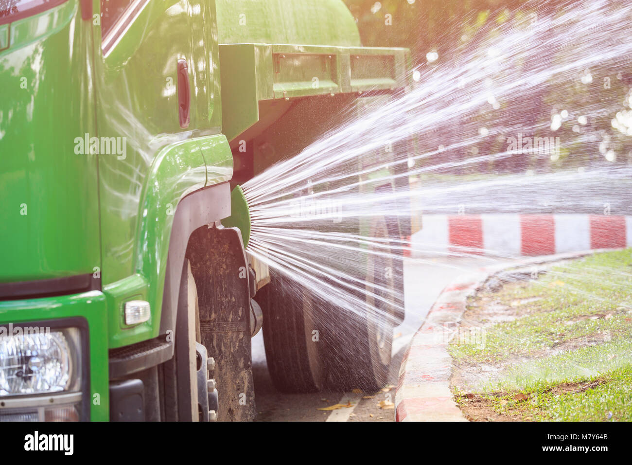 Water truck spraying water hi-res stock photography and images - Alamy