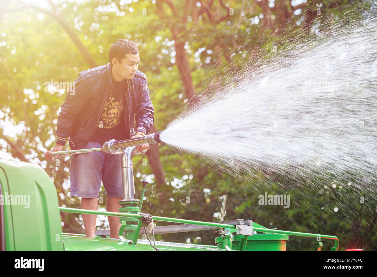 PHUKET, THAILAND - JUNE 20 : An unidentified people spraying water from ...