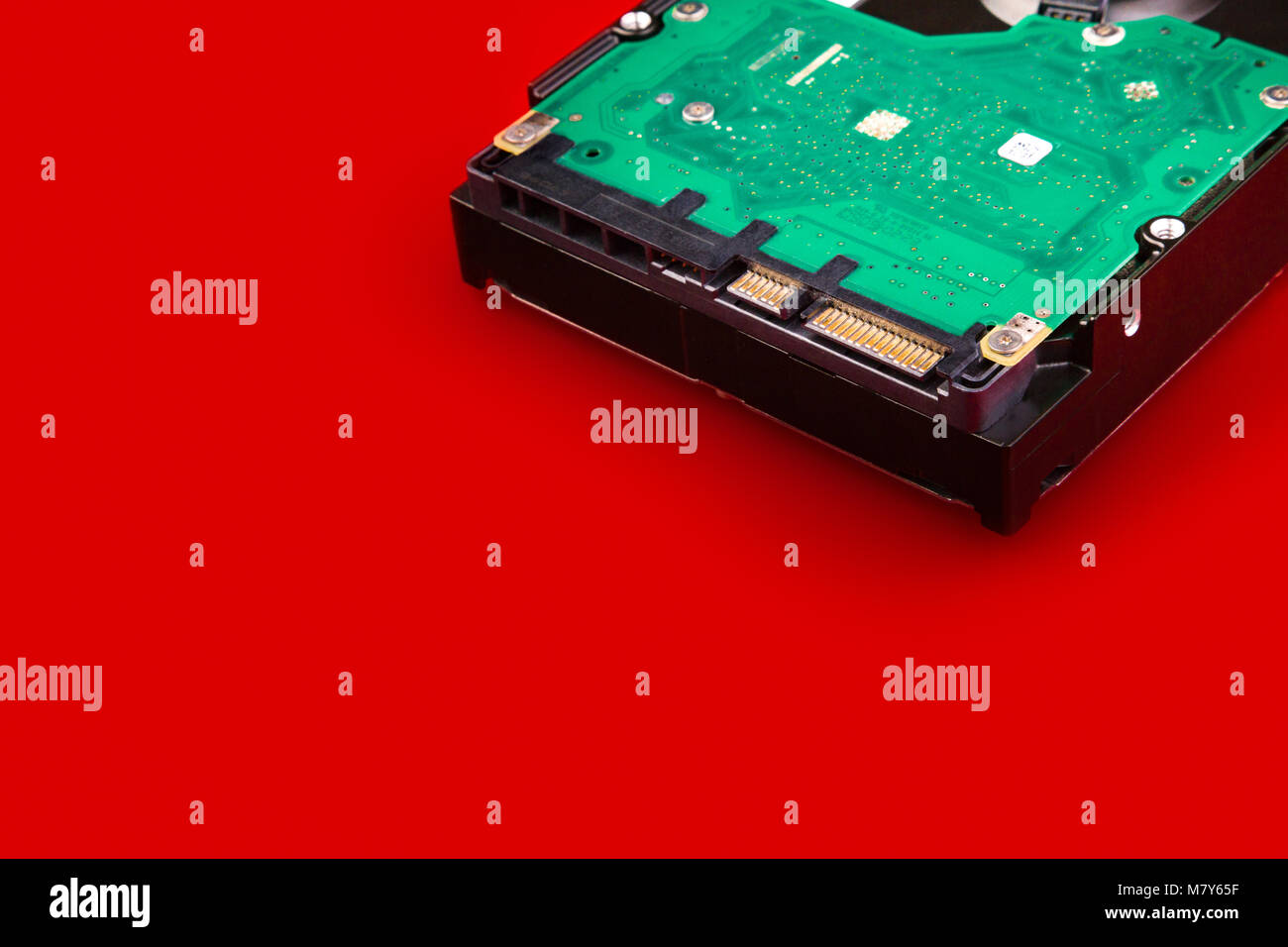 Computer hard drive on a red background with space for your text ...