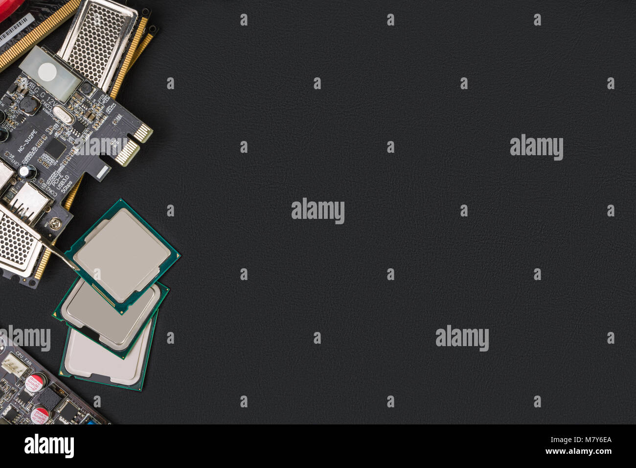 Computer parts and accessories on a black worktop with copy space ...