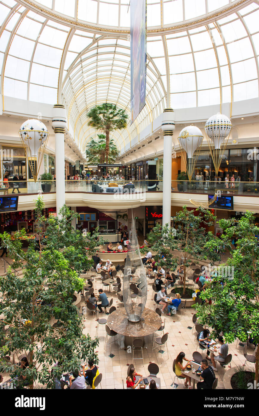Shoppers relax in an atrium inside the Chadstone Shopping Centre Stock ...