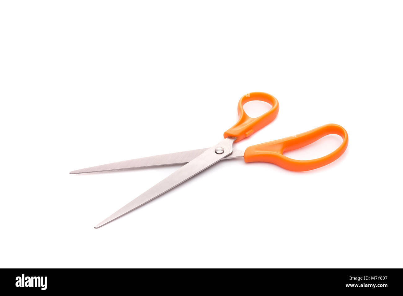 New orange stainless steel scissor. Studio shot isolated on white ...