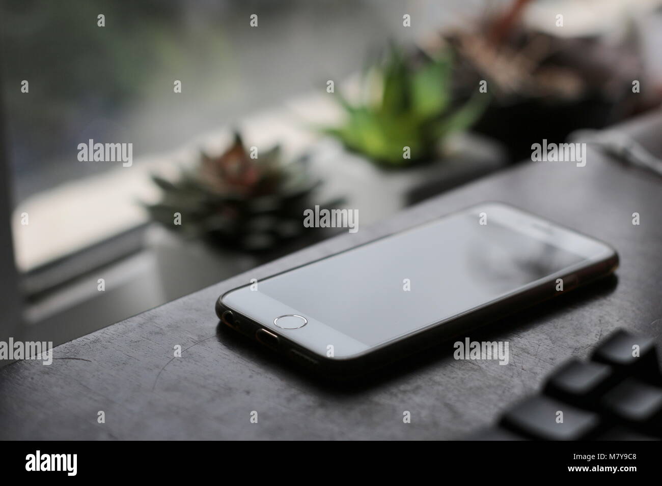 phone on desk Stock Photo - Alamy