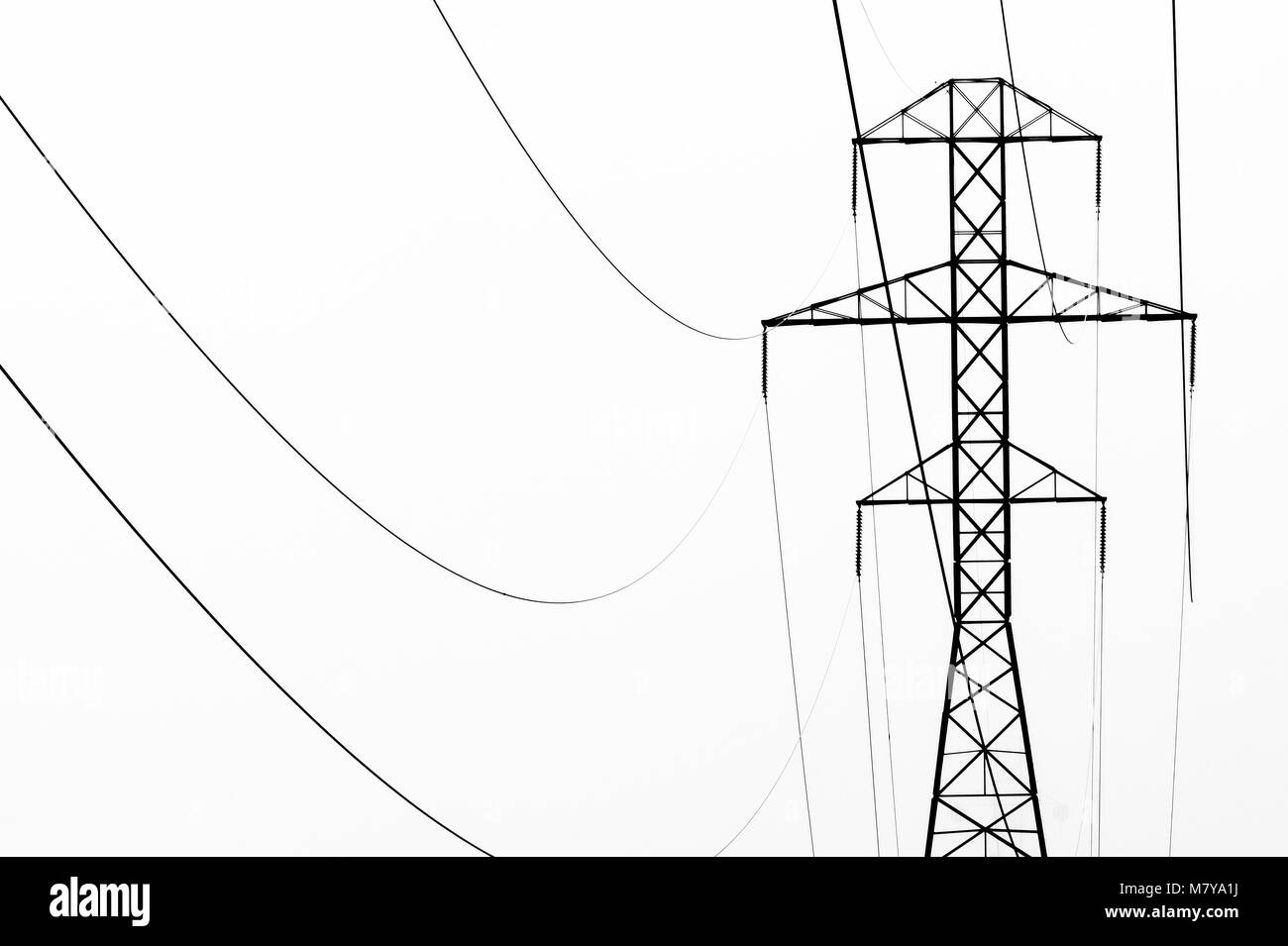 High key black and white abstract of powerline towers and fog Stock ...