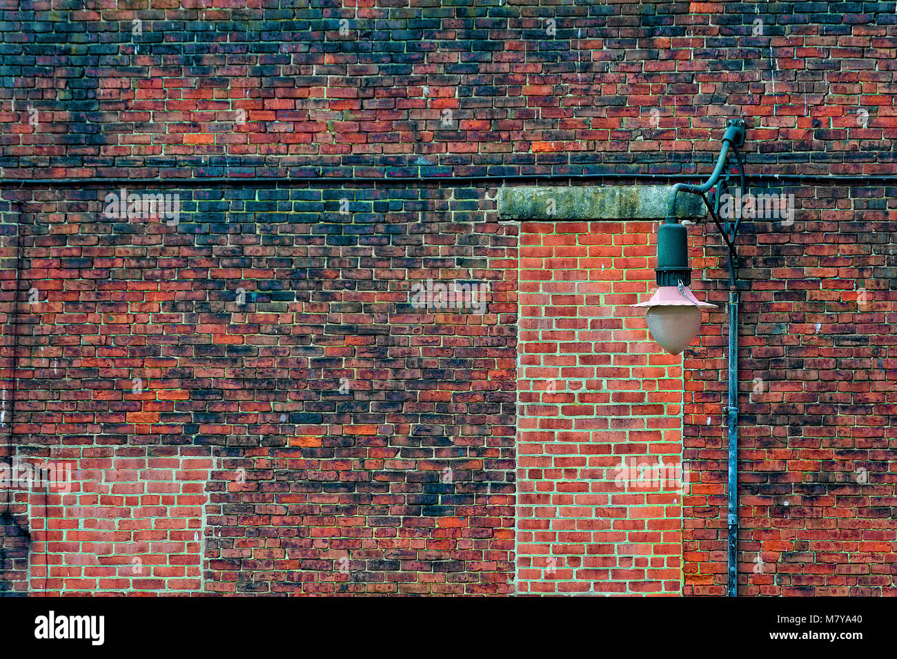 Old brick building and lamp post Stock Photo - Alamy