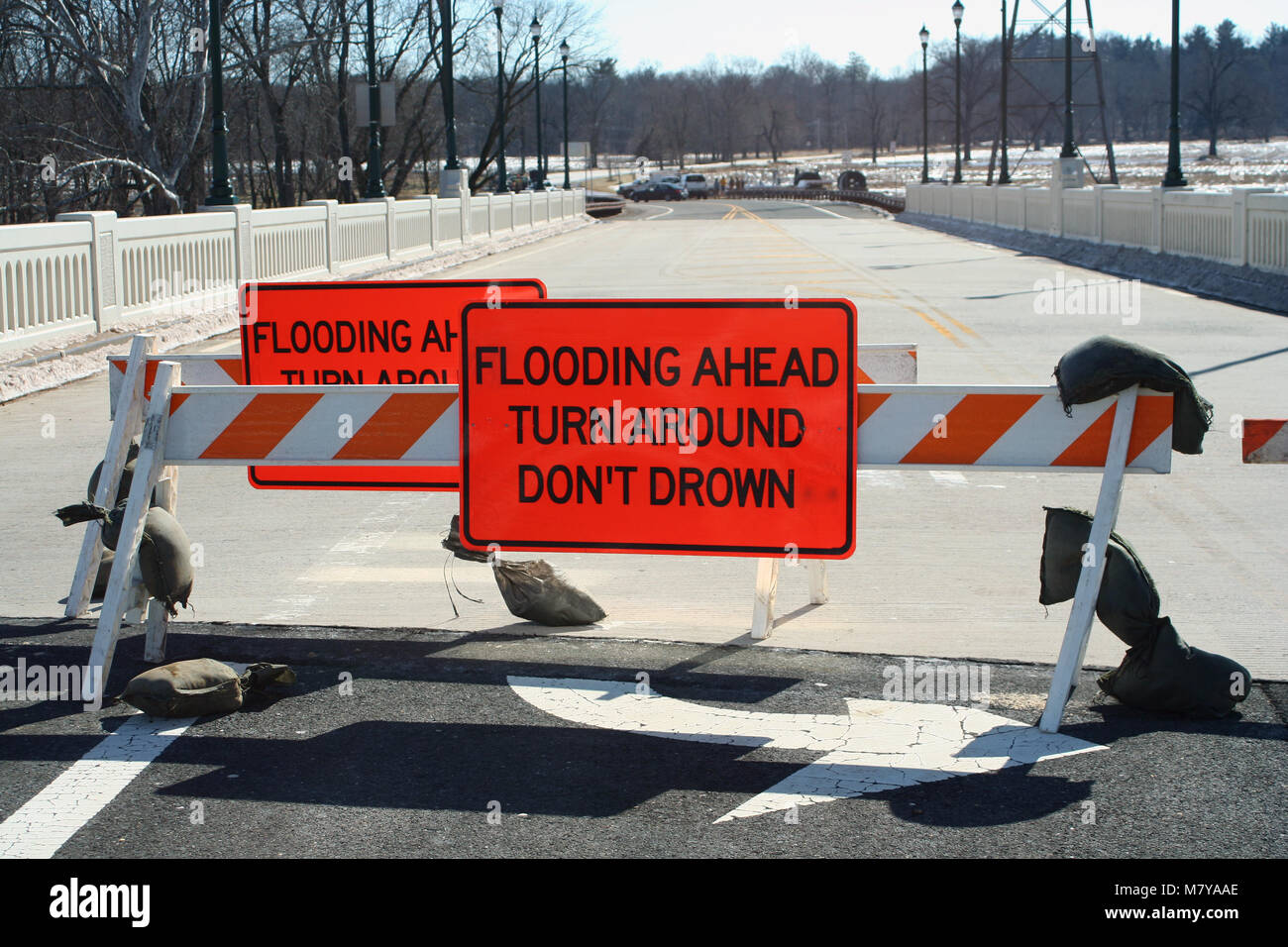 A Flooded roadway sign on a bridge Stock Photo - Alamy