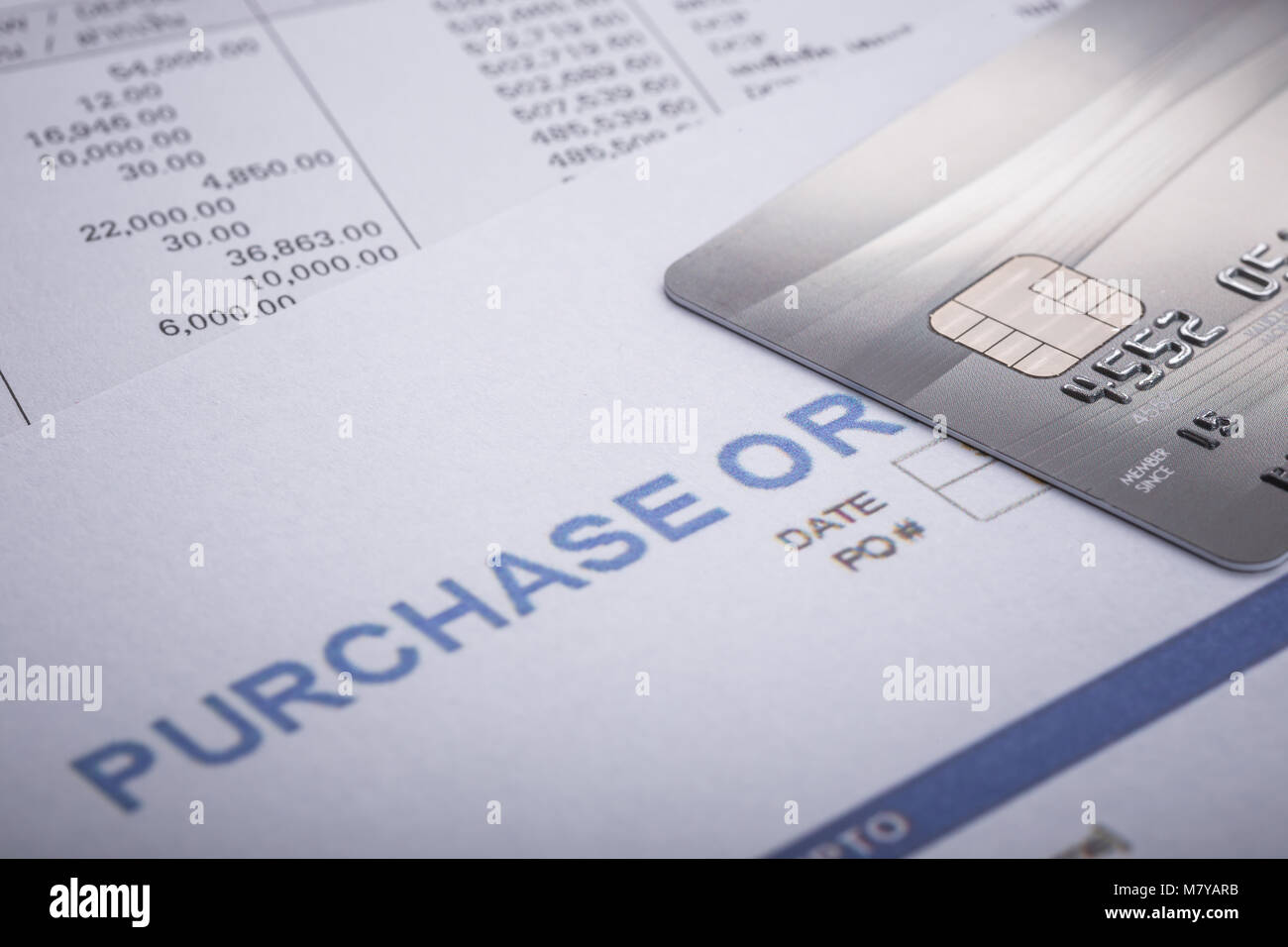 Close up credit card on purchase order in the office. For financial or ...