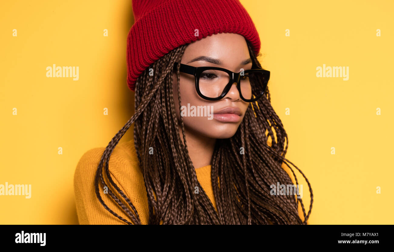 Fashionable young african american girl wearing red cap posing on ...