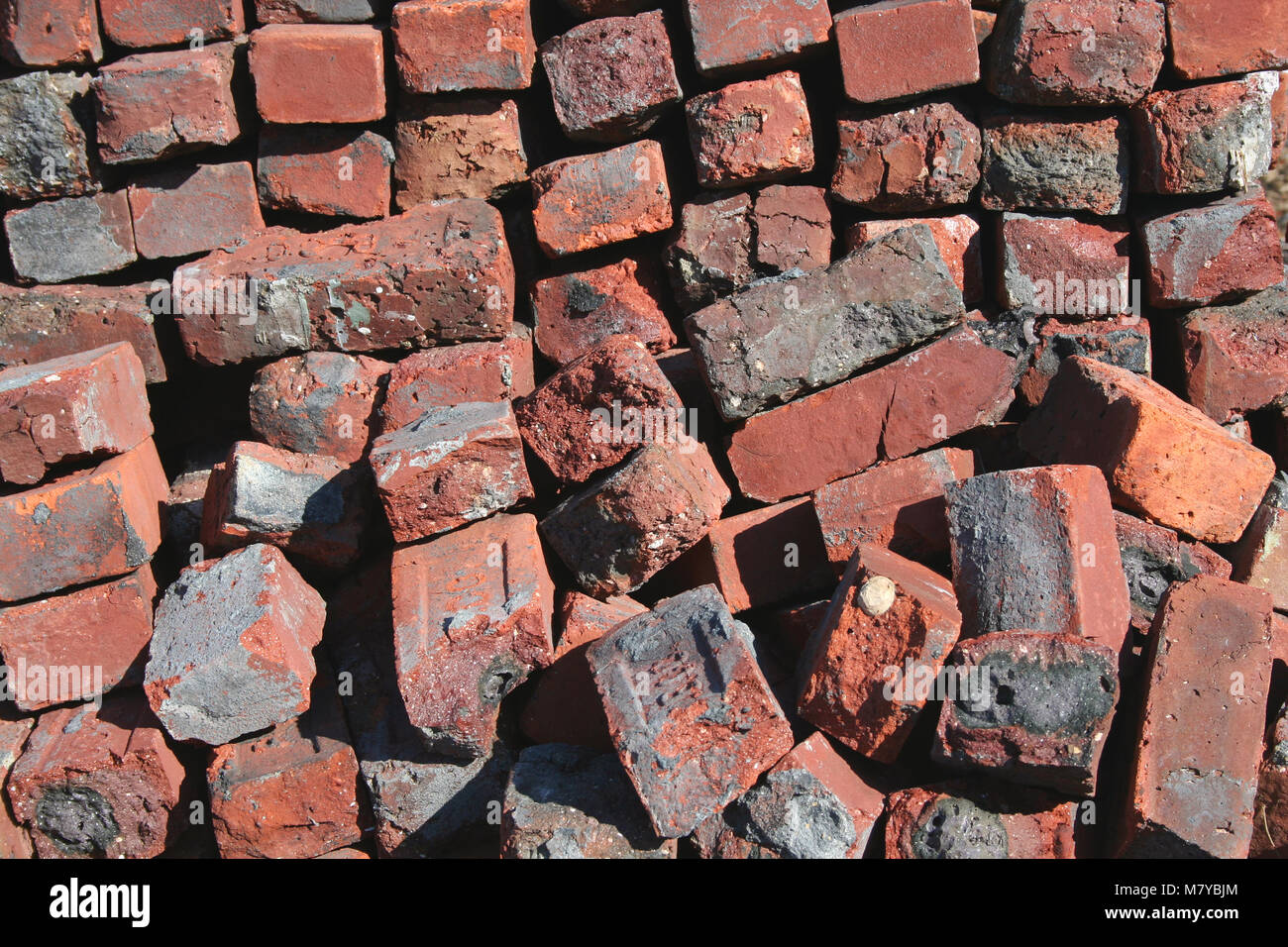 A Old red brick pile background Stock Photo - Alamy