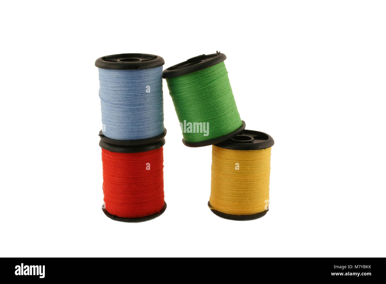 Red spool of thread over white Stock Photo - Alamy