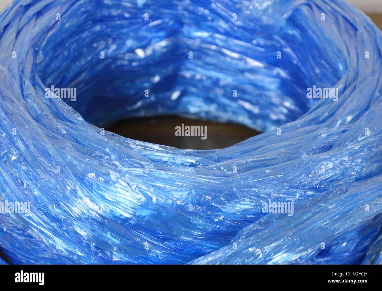 blue plastic robe rolling on table Stock Photo - Alamy