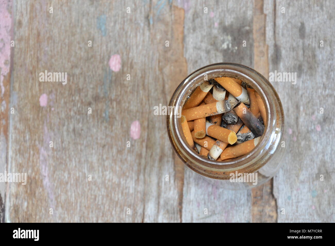 cigarette filter in glass bottle Stock Photo - Alamy