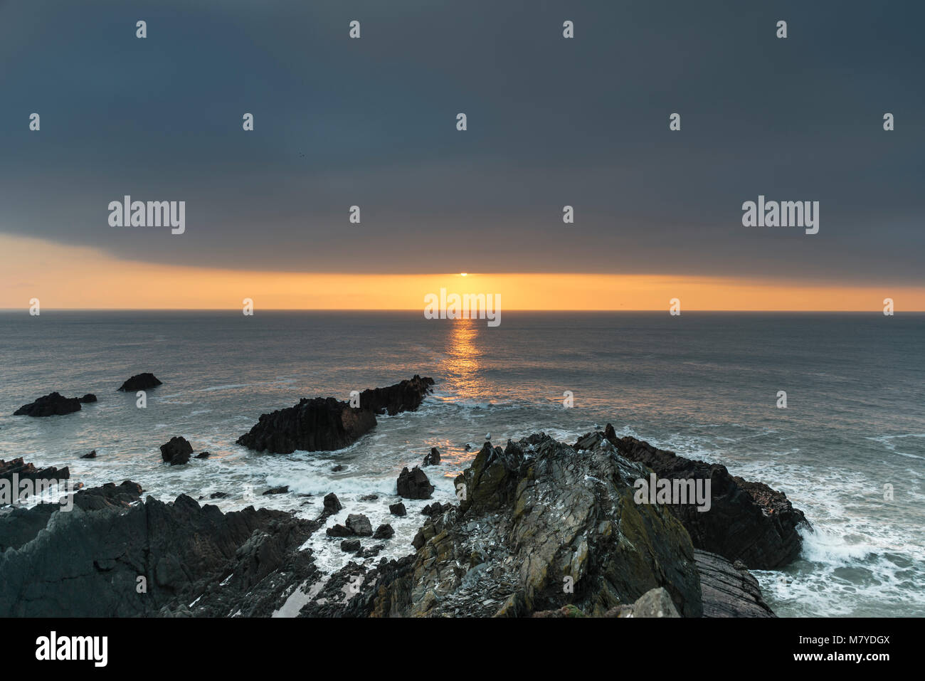 Sunset over the sea at Hartland Quay North Devon Stock Photo - Alamy
